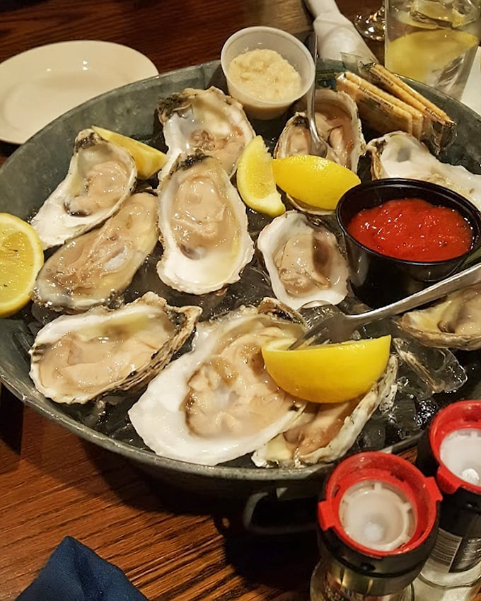 A dozen oysters on ice—nature's perfect appetizer and still cheaper than therapy for solving life's problems while pretending you're at a New England harbor. 