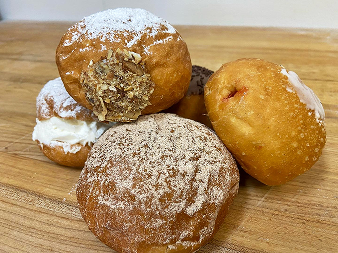 Golden-fried pączki that would make your Polish grandmother weep with joy. Filled with cream and dusted with sugar – resistance is futile.