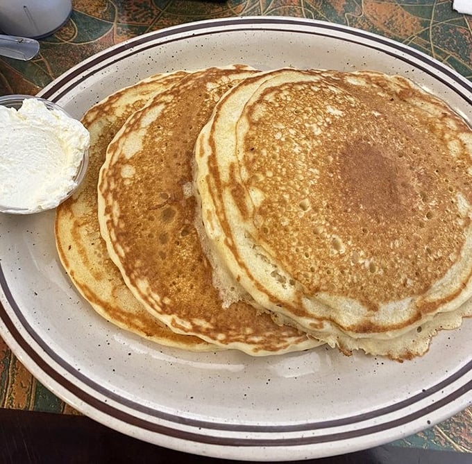 Pancakes so perfectly golden they belong in a breakfast hall of fame. The slight crisp at the edges gives way to pillowy centers.