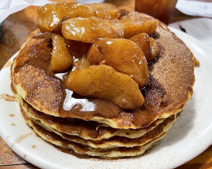 Stack attack! These pancakes topped with cinnamon apples aren't just breakfast—they're an edible postcard from Florida's comfort food capital.