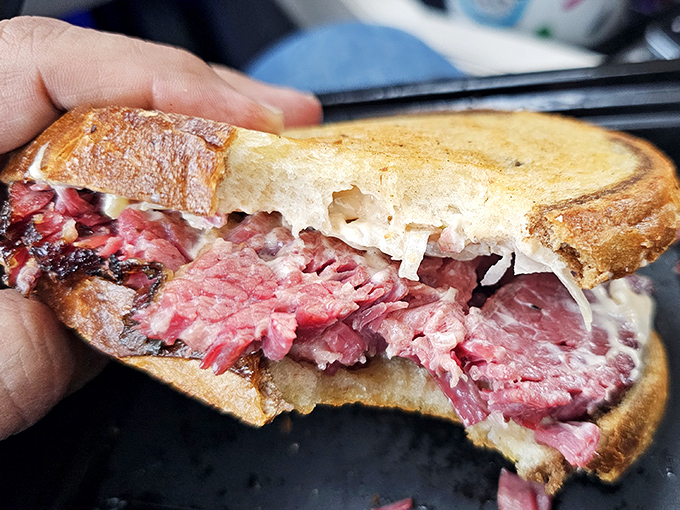 This isn't just a sandwich—it's a pastrami masterpiece that would make a New York deli owner weep with envy and possibly consider a career change.