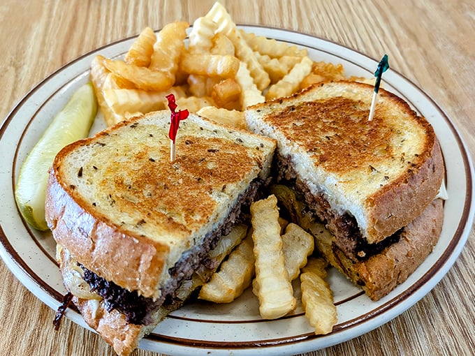 A proper patty melt doesn’t need truffle aioli or fancy bread—just honest ingredients and a griddle seasoned by years of doing it right.