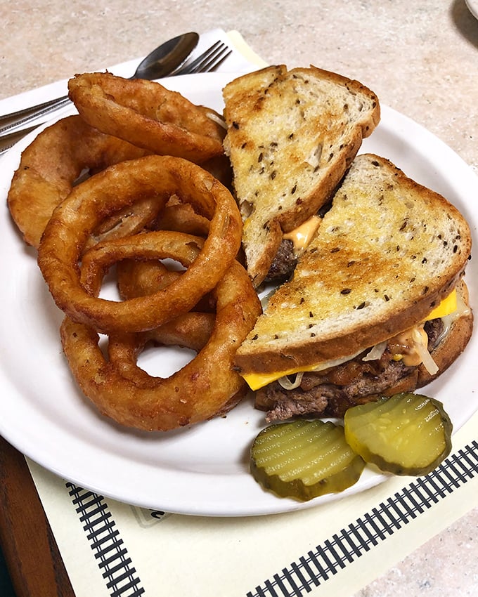 The patty melt that bridges breakfast and lunch like a delicious diplomatic ambassador.