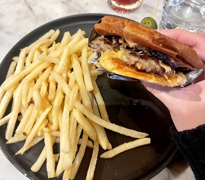 The patty melt—that magical union of beef, bread, and cheese—flanked by fries so perfectly golden they deserve their own Instagram account.