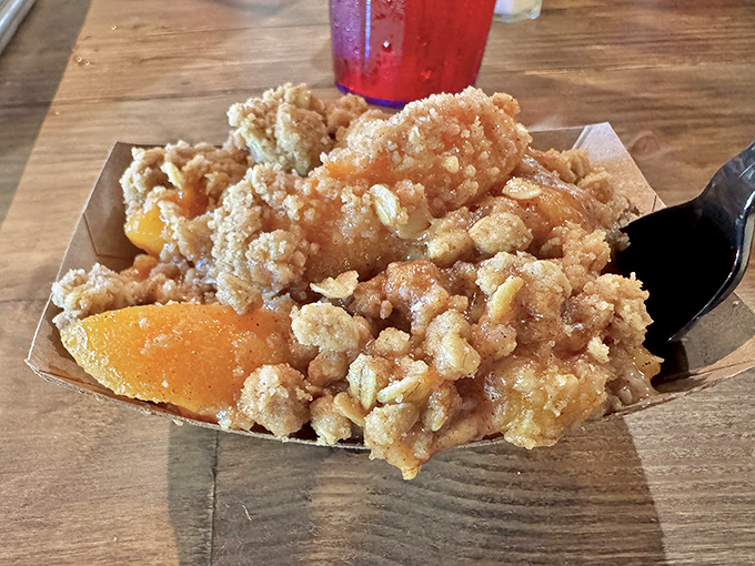 This peach cobbler doesn't just have a golden crust—it has the kind of crumble topping that makes you forget your table manners.