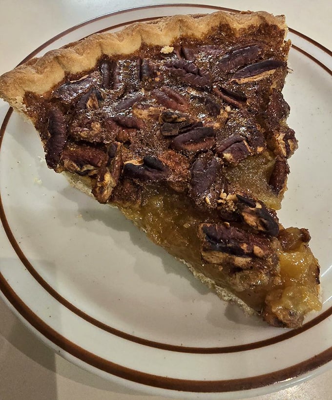 Pecan pie that strikes the perfect balance between sweet and nutty—the kind that makes you consider ordering a second slice before finishing the first.