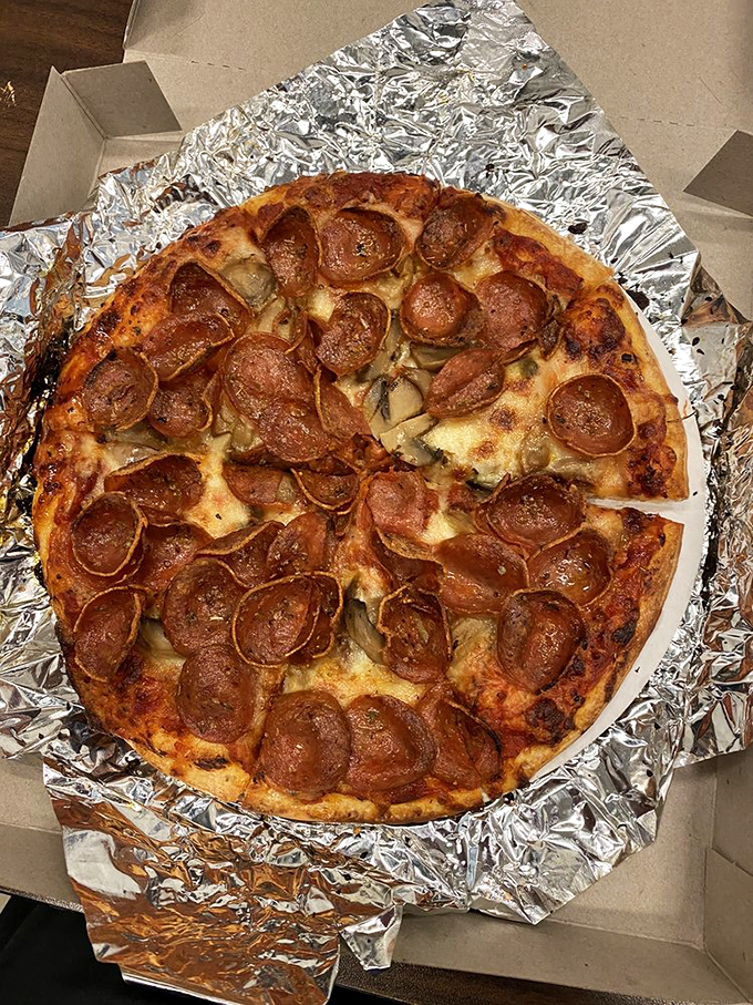 The pepperoni has achieved that perfect curl, creating little cups of savory oil that should be in the Pizza Hall of Fame, if such a place existed. 