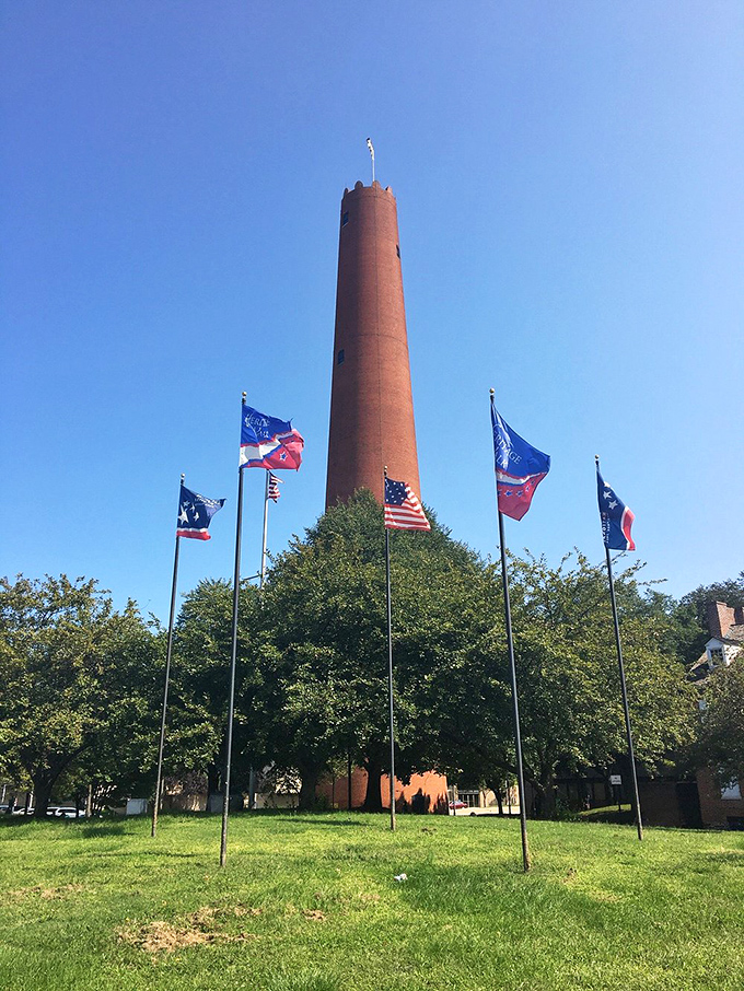 Surrounded by a circle of flags, the tower reaches skyward—a 234-foot testament to American ingenuity that's outlasted countless skyscrapers.