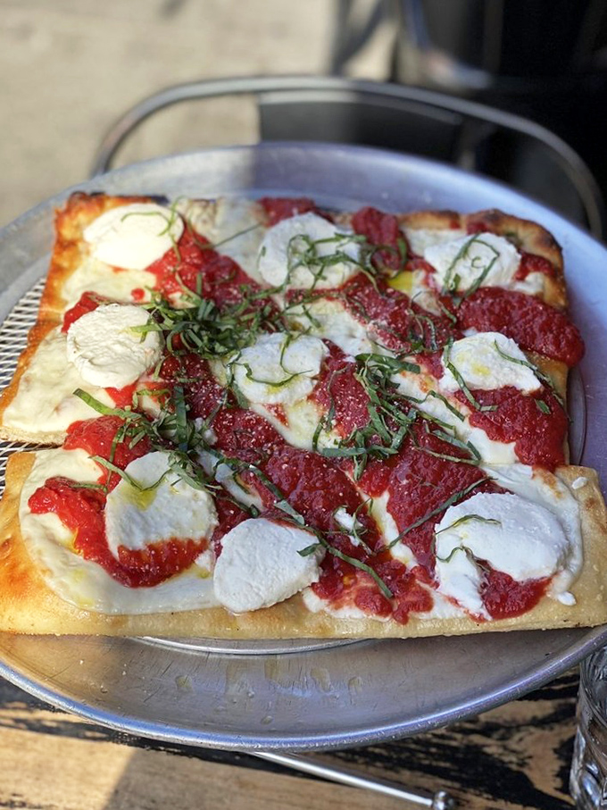 The Margherita reimagined as a rectangle—proof that great pizza doesn't need to fit inside traditional circular boundaries.