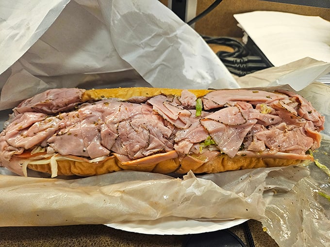 A ham sandwich so generous it should come with its own payment plan. This isn't lunch—it's a commitment to excellence.