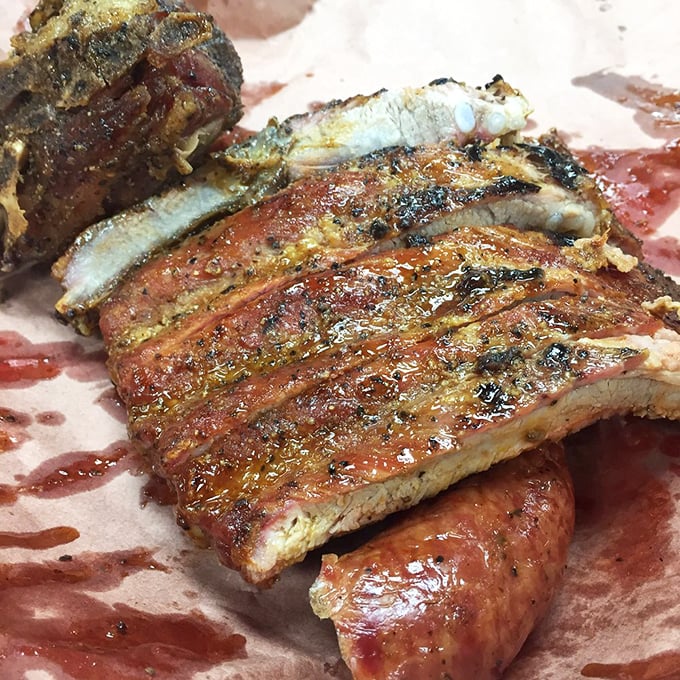 Ribs with that perfect "tug"—not falling off the bone (that's overdone) but yielding with just the right amount of resistance.