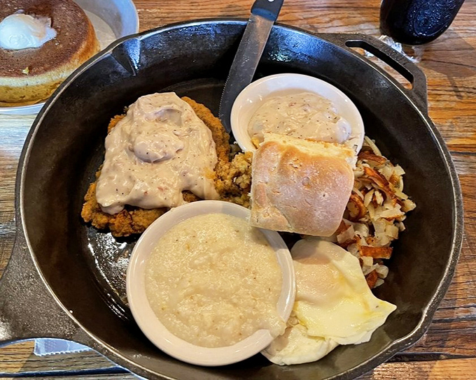 The Postmaster's Breakfast arrives in its own zip code – a cast iron skillet filled with enough sustenance to fuel your Smoky Mountain adventures.