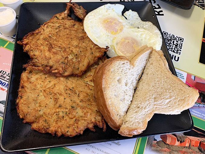 Behold the potato pancake breakfast – where crispy meets fluffy in a dance older than disco but twice as satisfying.