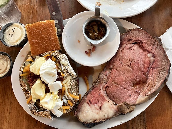 Prime rib so perfectly pink it could make a vegetarian question their life choices. That loaded baked potato is playing no small supporting role.