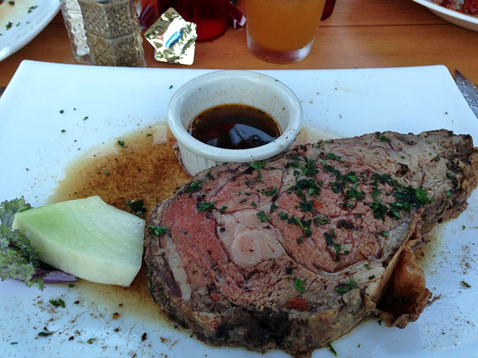 Prime rib so perfectly pink it makes you want to write poetry. The au jus cup isn't optional—it's essential life support for this meaty masterpiece.