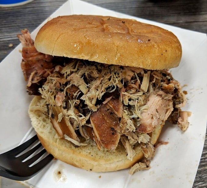 A pulled chicken sandwich that puts ordinary lunch options to shame. Fluffy bun, mountain of meat—lunch of champions.