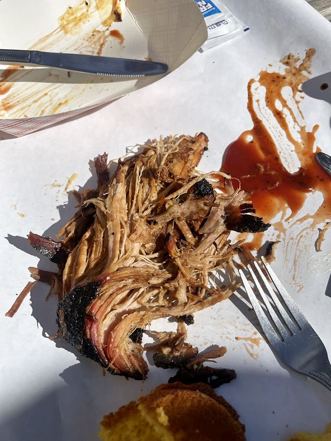 Evidence of a crime scene—the delicious dismantling of perfectly smoked pulled pork. The sauce-splattered paper tells the whole delicious story.