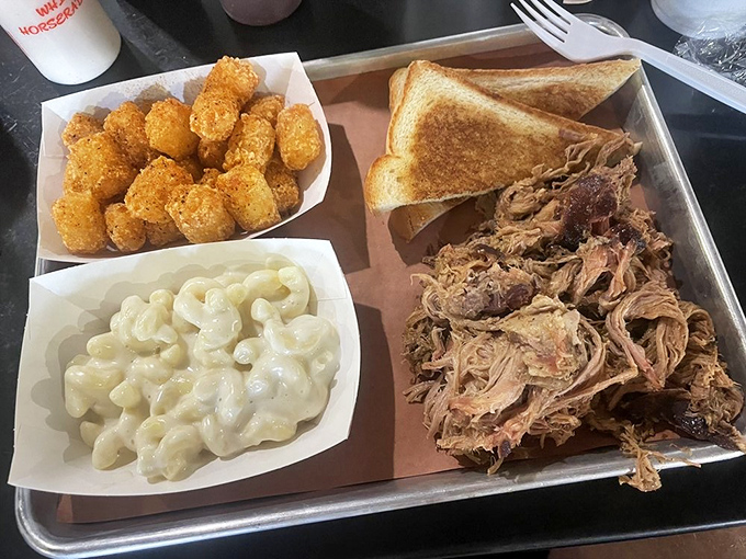 A barbecue trinity: pulled pork, mac and cheese, and tater tots. Some might call this comfort food—I call it the reason elastic waistbands were invented.