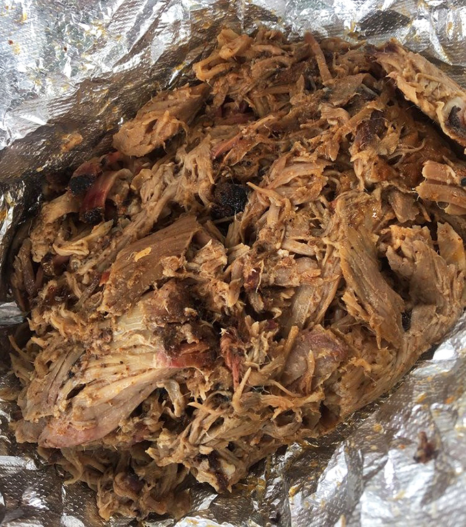 Pulled pork that actually stays pulled—not mushy, not dry, but that perfect sweet spot where smoke and moisture create textural harmony.
