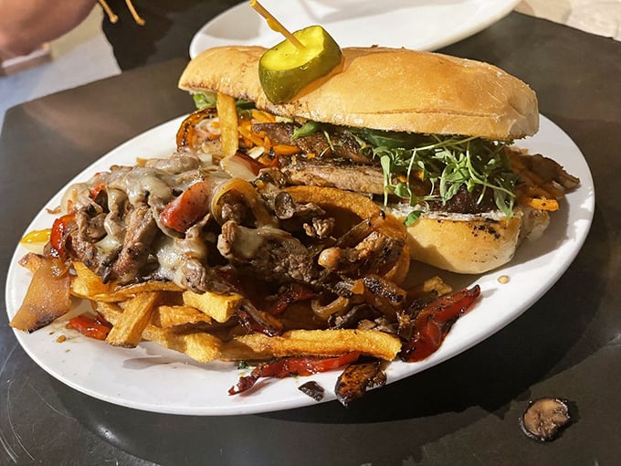This isn't just a sandwich—it's architecture you can eat. Steak, mushrooms, and fries create the skyline of Flavortown's downtown district.