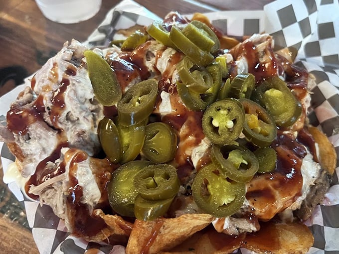 Nachos reimagined with pulled pork and jalapeños—a Tennessee twist that makes traditional nachos seem like they've been underachieving their entire existence.