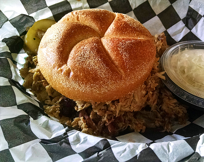 When pulled pork is piled this high on a kaiser roll, it's not just a sandwich – it's an architectural achievement worthy of its own Pennsylvania historical marker.