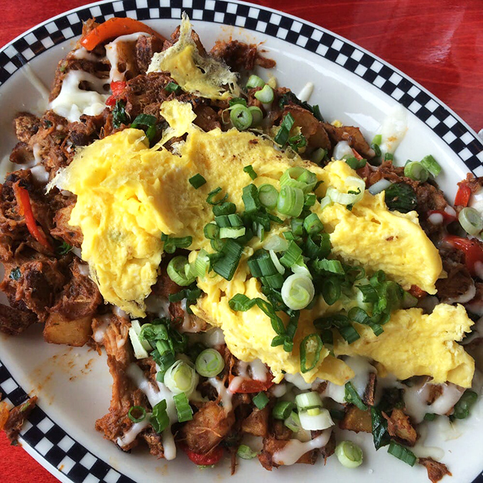 When pulled pork meets morning eggs, magic happens – this is breakfast for people who mean business.