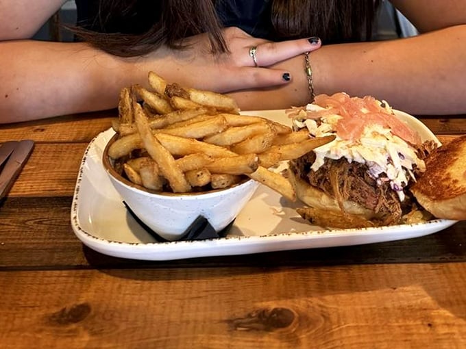 A sandwich that requires both hands and possibly a bib – the kind of meal that makes you grateful for whoever invented napkins.