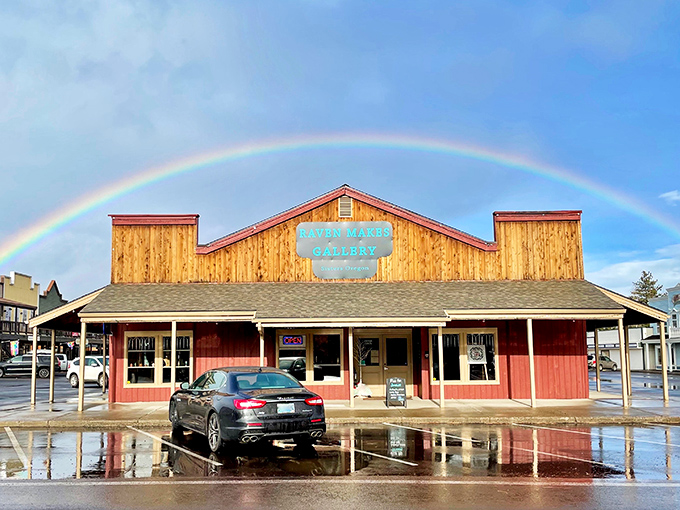 Raven Makes Gallery under a perfect rainbow—even the weather coordinates with the town's aesthetic. Talk about commitment to the visitor experience!