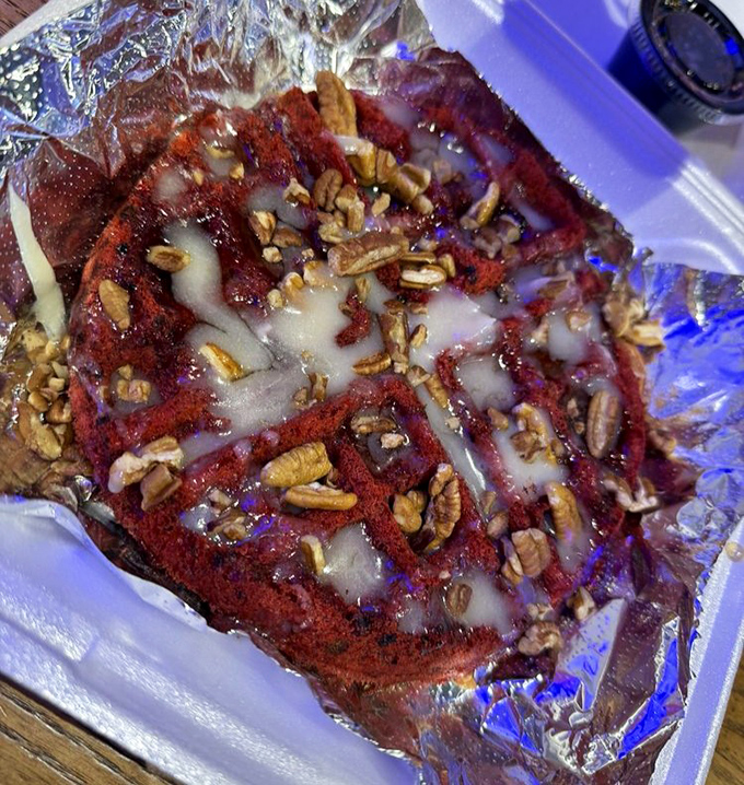 A red velvet waffle topped with pecans and drizzled with sweetness—proof that Krustaceans understands the importance of a proper seafood chaser.