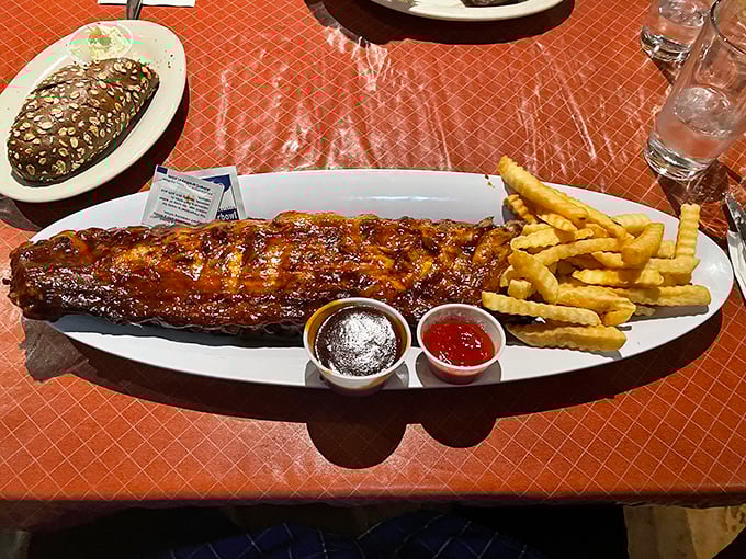 These ribs don't just fall off the bone—they practically leap onto your fork in their eagerness to introduce themselves to your taste buds.