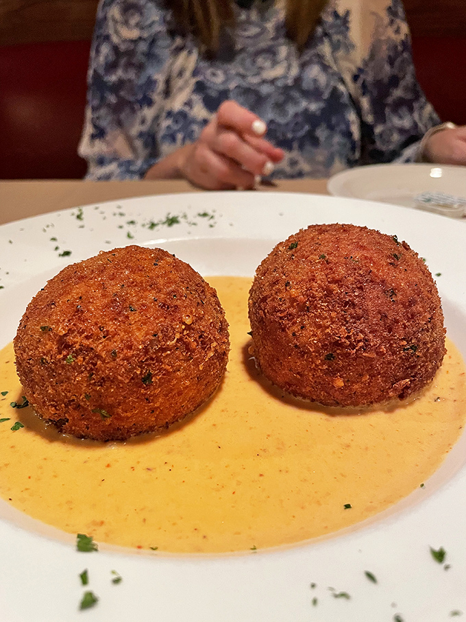 These golden arancini are the superheroes of appetizers—crispy armor on the outside, creamy risotto and surprise fillings within.