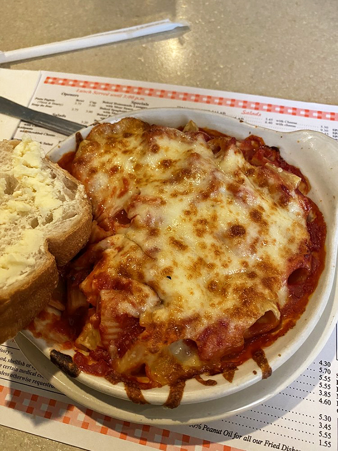 This isn't just pasta with sauce—it's a relationship. The rigatoni's ridges capture the perfect amount of that slow-simmered tomato goodness.