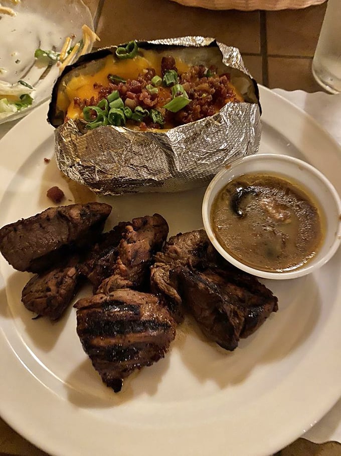 Steak tips with a loaded baked potato – proof that sometimes the supporting actors deserve just as much applause as the headliners.