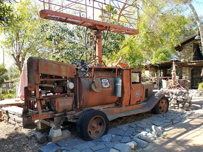 This vintage fire truck didn't retire—it reinvented itself as castle yard art. Even emergency vehicles deserve a peaceful second act in paradise.