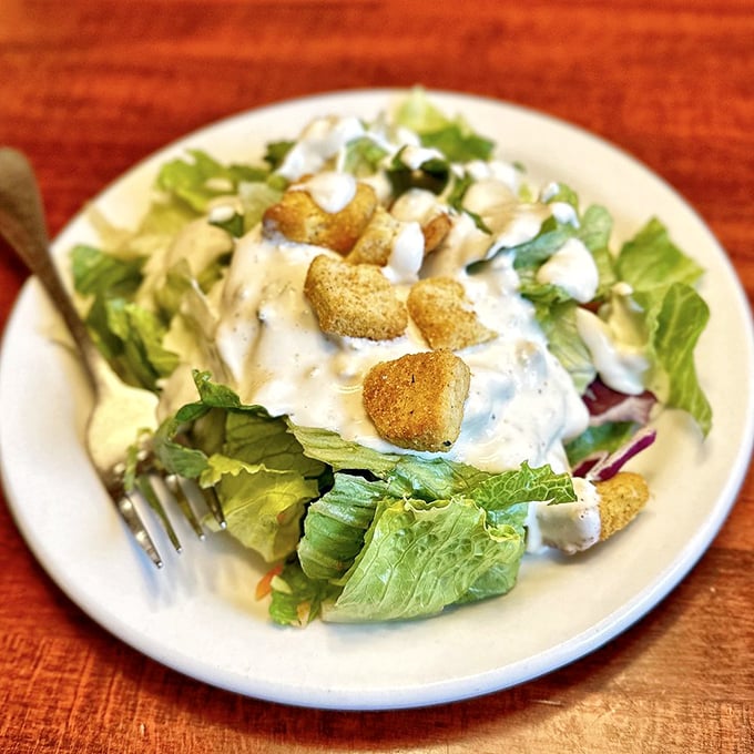 A salad that actually deserves to be called a meal. Those house-made croutons aren't just participating—they're stealing the show.