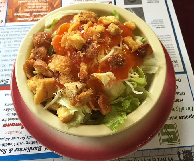 A salad that doesn't apologize for being exactly what it is: fresh, crunchy, and topped with enough croutons to make a carb-counter weep.
