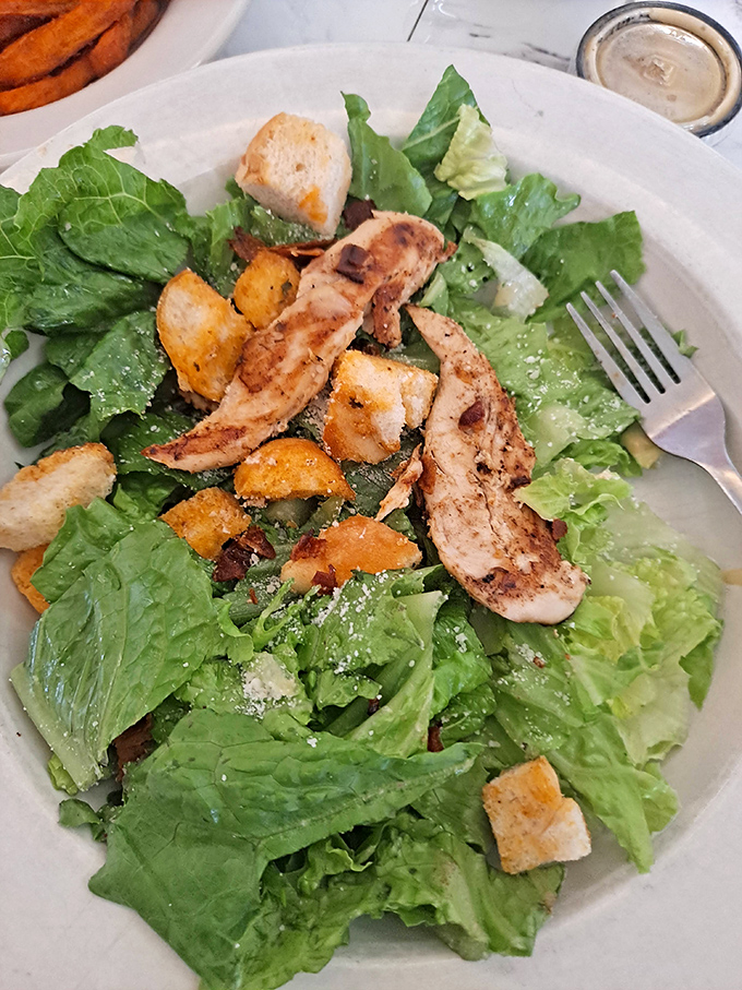 For when your conscience calls: a Caesar salad that doesn't apologize for being exactly what it should be—fresh, simple, and satisfying.