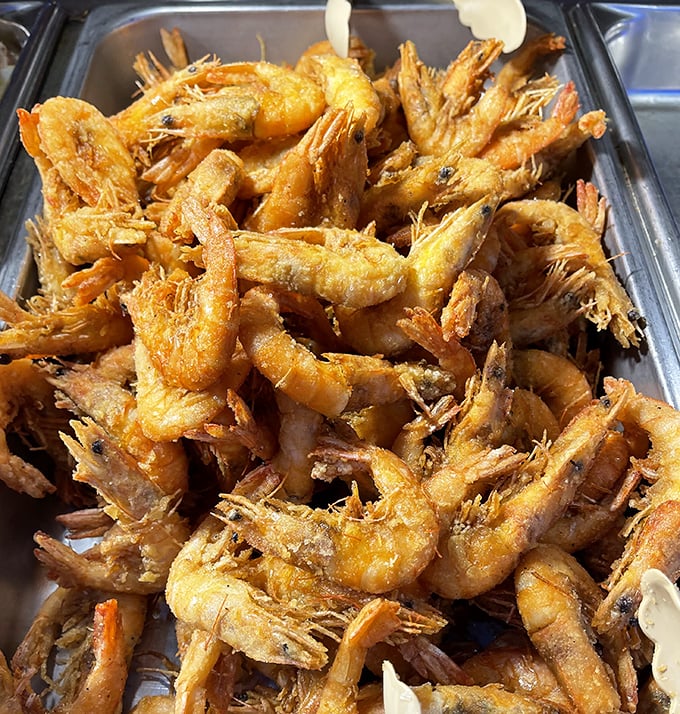 These golden-battered shrimp aren't just fried—they're transformed into crispy vessels of oceanic delight that disappear from plates at alarming speeds.