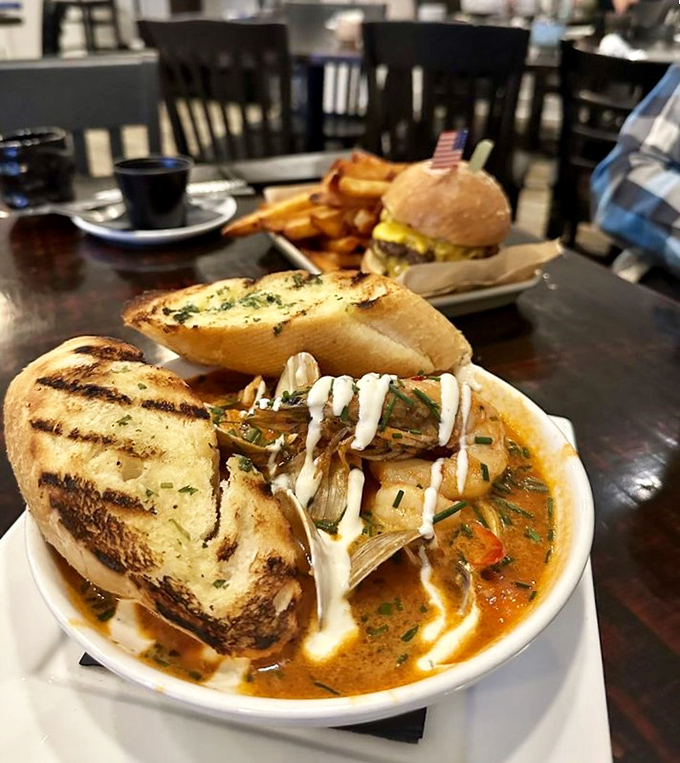 This isn't just soup—it's a seafood symphony in a bowl, where crusty bread plays backup to the star crustacean.