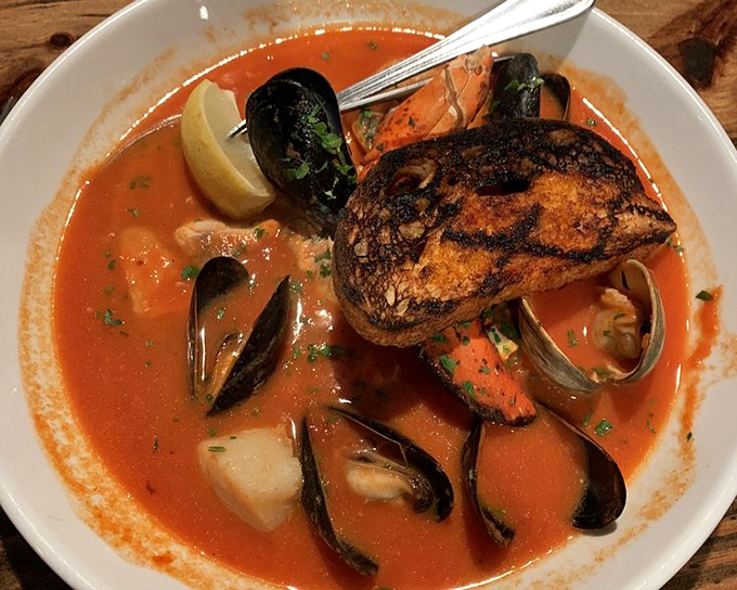 This seafood stew doesn't just warm your body—it tells stories of coastal traditions with each spoonful of tomato-bathed treasures from the deep.