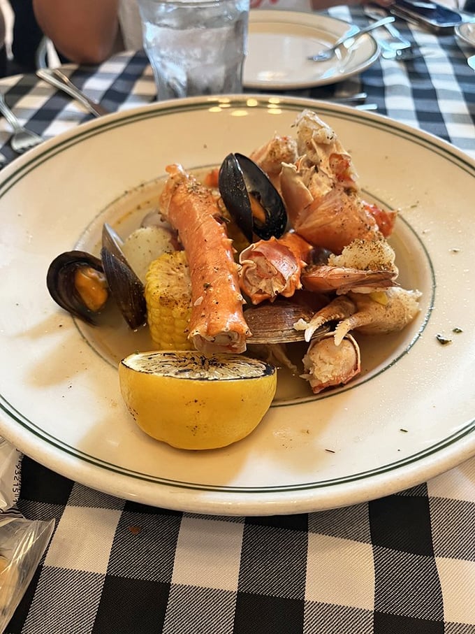 A seafood symphony in a bowl—where crab legs, mussels, and corn perform a delicious maritime concerto with lemon as the conductor.