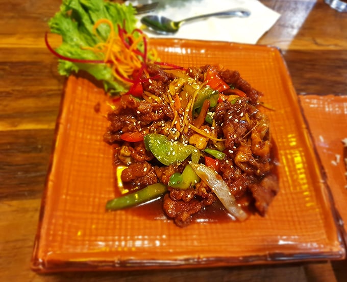 This isn't just duck—it's duck that went to finishing school. Glazed to perfection and surrounded by vibrant vegetables in a sauce worth bottling.