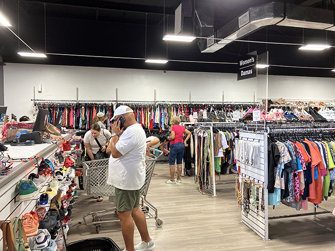 The thrill of the hunt in action – fellow treasure seekers navigate the aisles with shopping carts poised for unexpected discoveries.