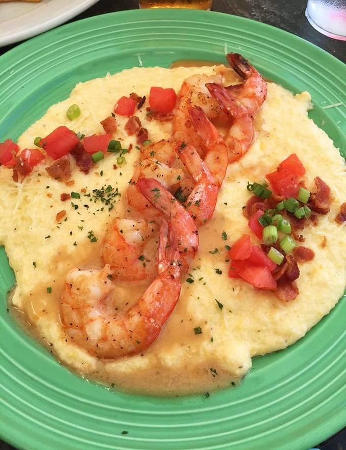 These shrimp and grits tell a Southern story with every bite—creamy yellow cornmeal providing the perfect stage for Gulf shrimp to take their well-deserved bow.