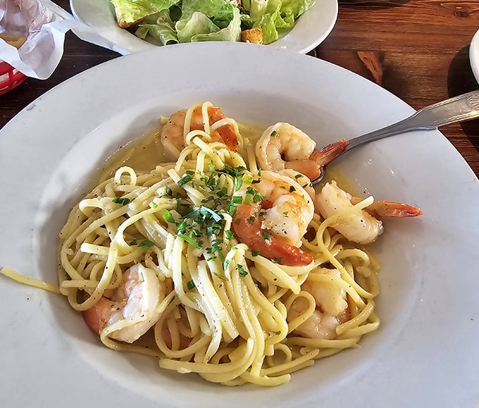 Shrimp scampi that whispers "vacation" with every bite—plump shrimp and al dente pasta bathed in garlic-infused goodness.
