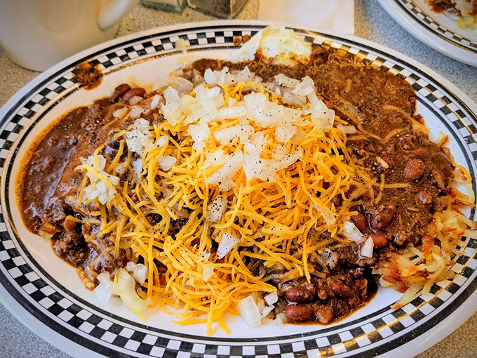 The legendary St. Louis Slinger—where hash browns, hamburger, eggs, and chili unite in a magnificent mess that's worth every napkin you'll need afterward.
