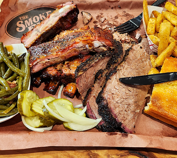 Brisket perfection on a platter – that pink smoke ring tells the whole delicious story.