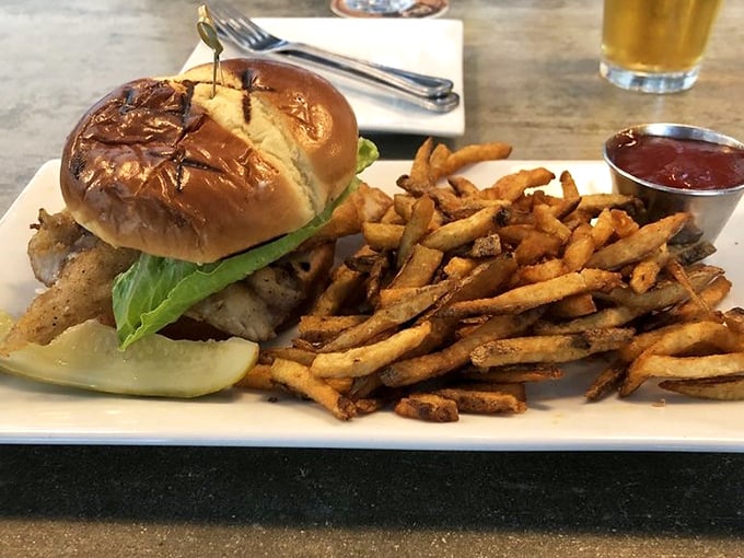Proof that sandwiches can be life-changing experiences. Golden fries, toasted bun, and fresh fish – lunch doesn't get more satisfying than this.