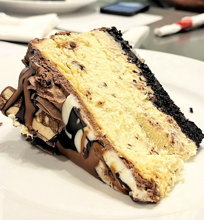 Not all heroes wear capes—some wear Oreo crusts. This Snickers cheesecake layer cake is what dessert dreams are built on.